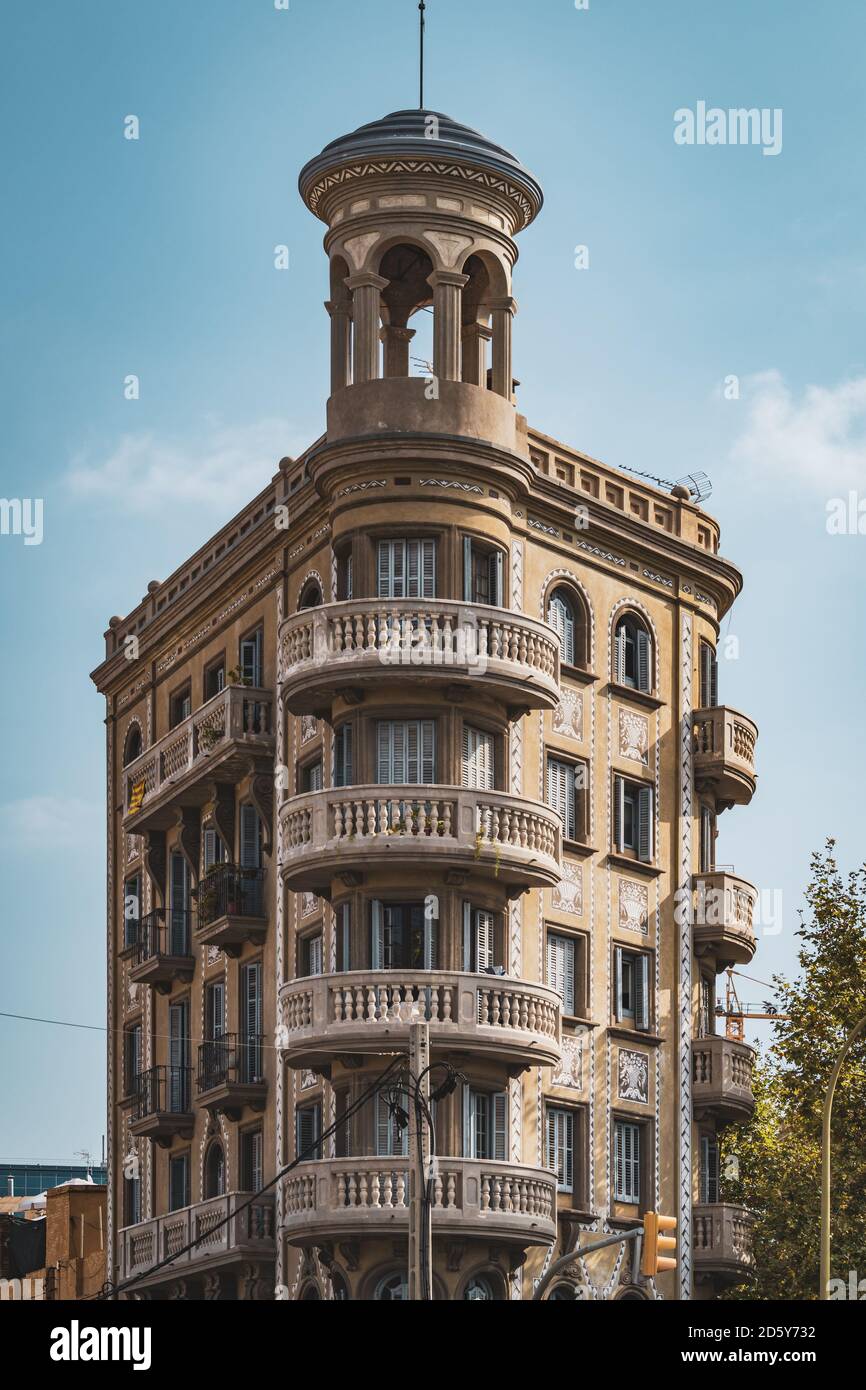 Circular balconies on the rounded corner of a neoclassical building ...