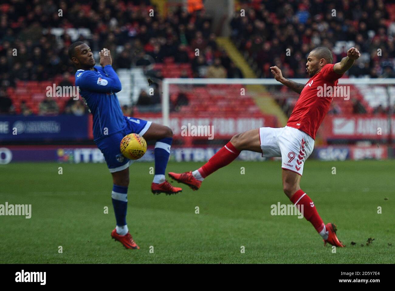 Charlton Athletic's Josh Magennis (left) and Oldham Athletic's Ryan ...