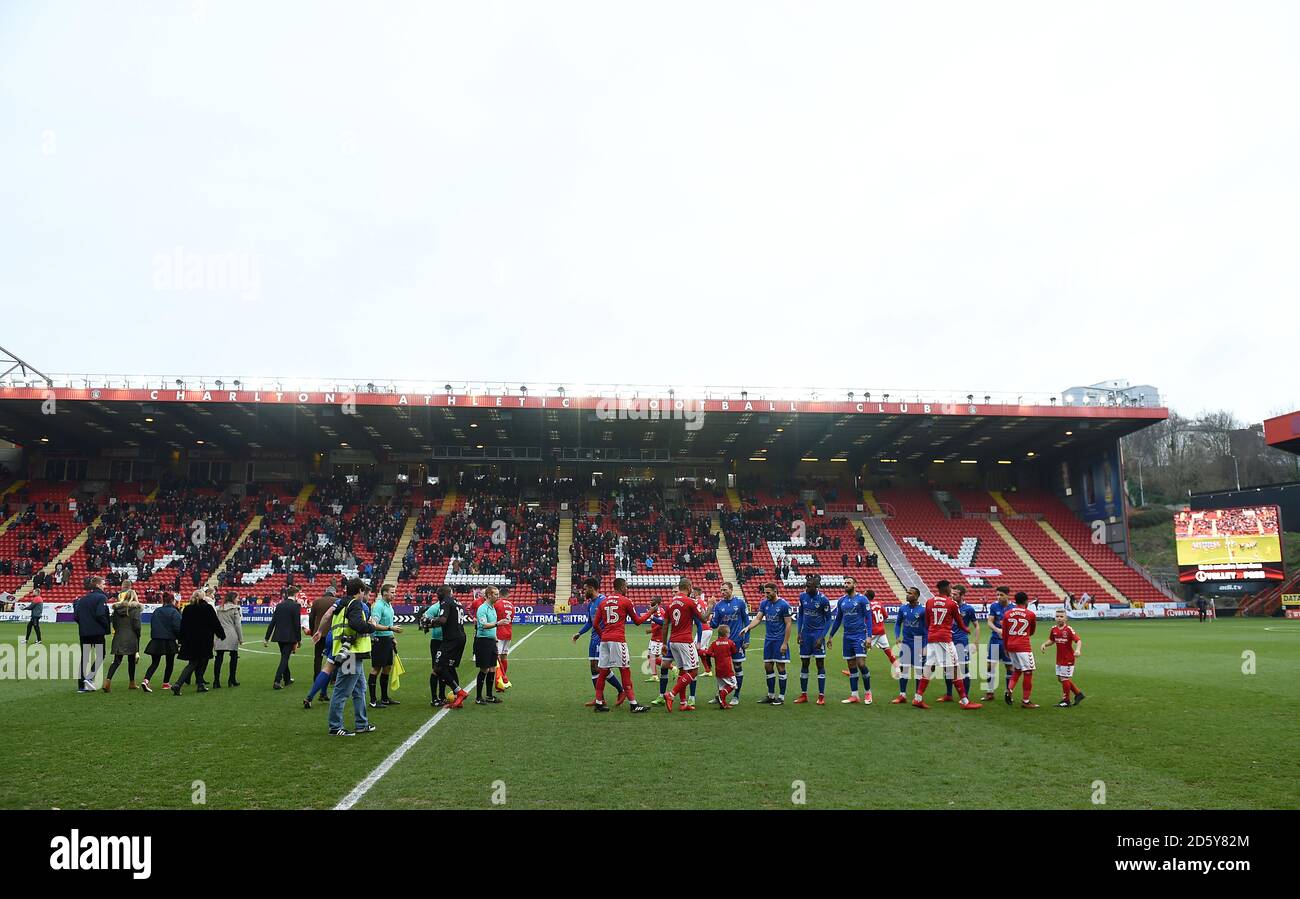 Charlton Athletic players and mascots shake hands with Oldham Athletic ...