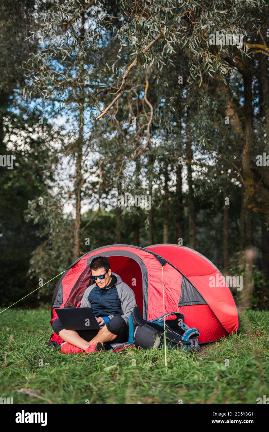 Man Using Laptop Computer Camping High Resolution Stock Photography and ...