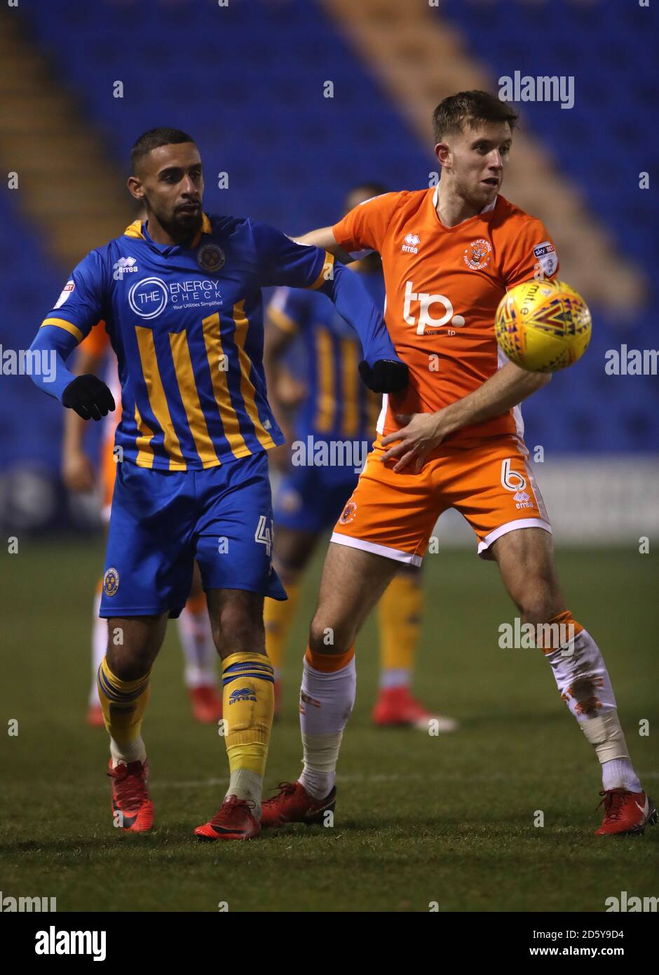 Shrewsbury Town's Stefan Payne holds off challenge from from Blackpool ...