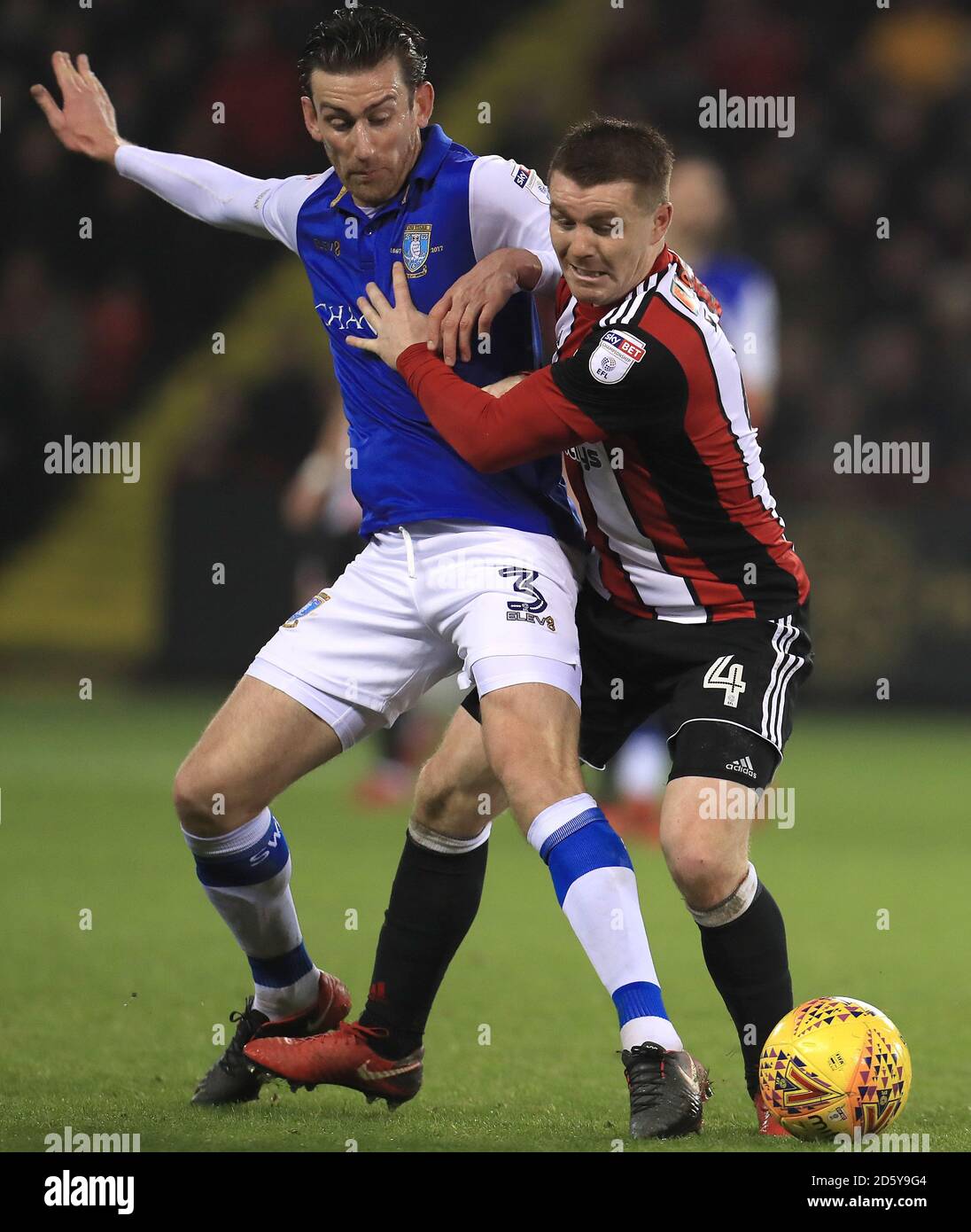 Sheffield Wednesday's David Jones (left) and Sheffield United's John ...