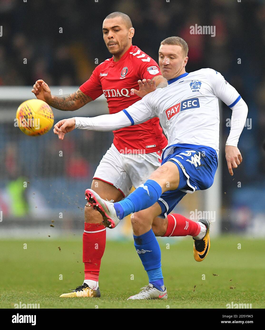 Charlton Athletic's Josh Magennis battles with Bury's Joe Skarz (right ...