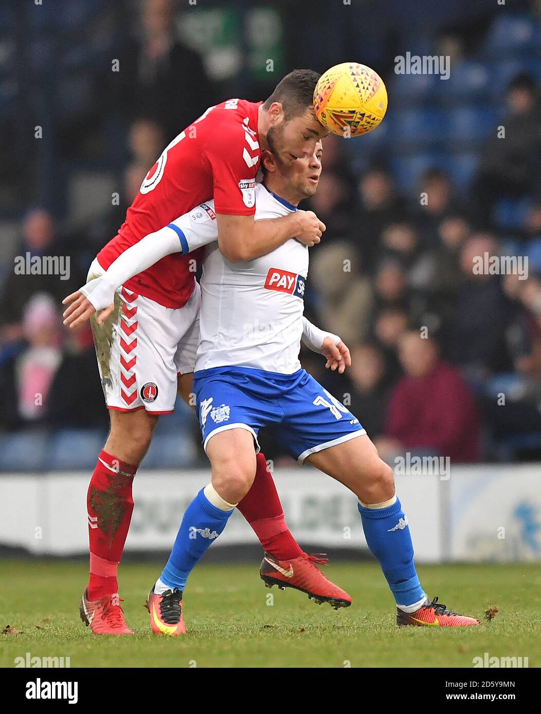 Charlton Athletic's Harry Lennon (left) battles with Bury's Zeli Ismail ...