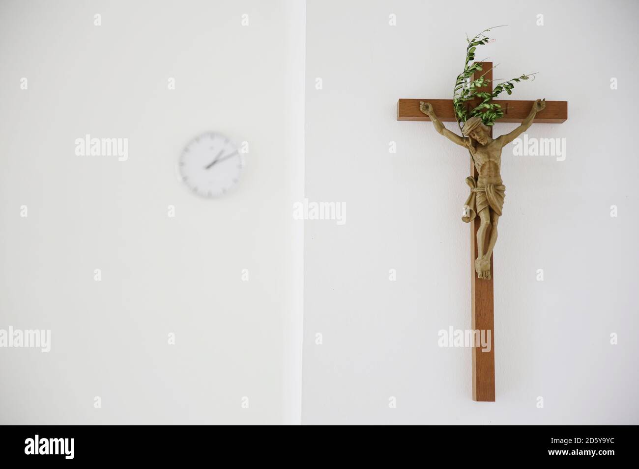 Cross and clock in a presbytery Stock Photo - Alamy