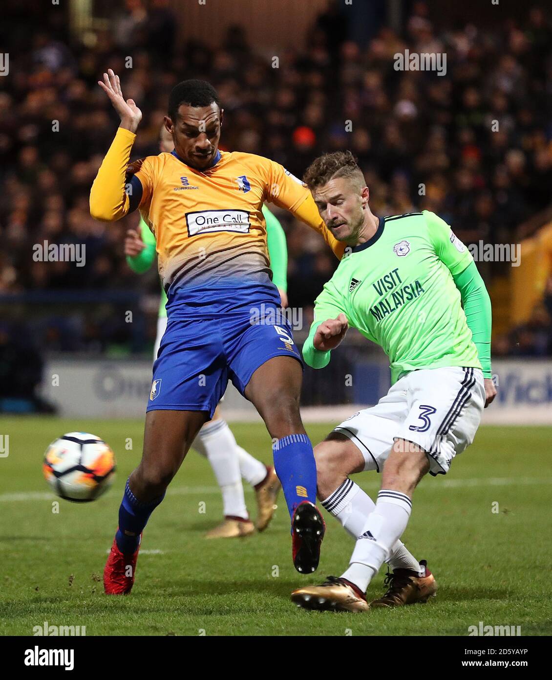 Cardiff City's Joe Bennett (right) clears from Mansfield Town's ...