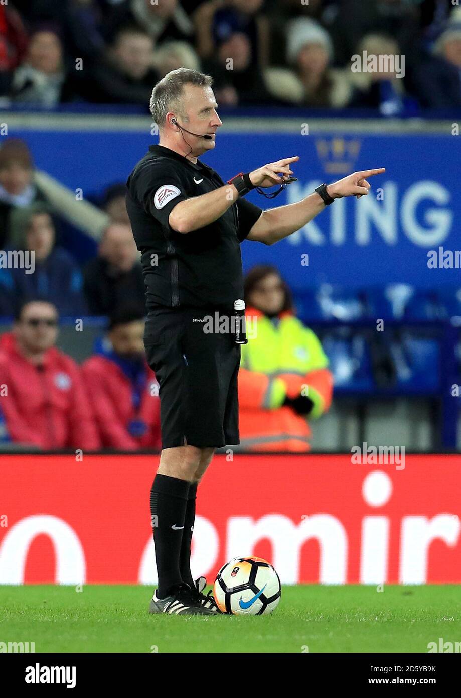 Match referee Jon Moss signals that VAR is in use Stock Photo - Alamy