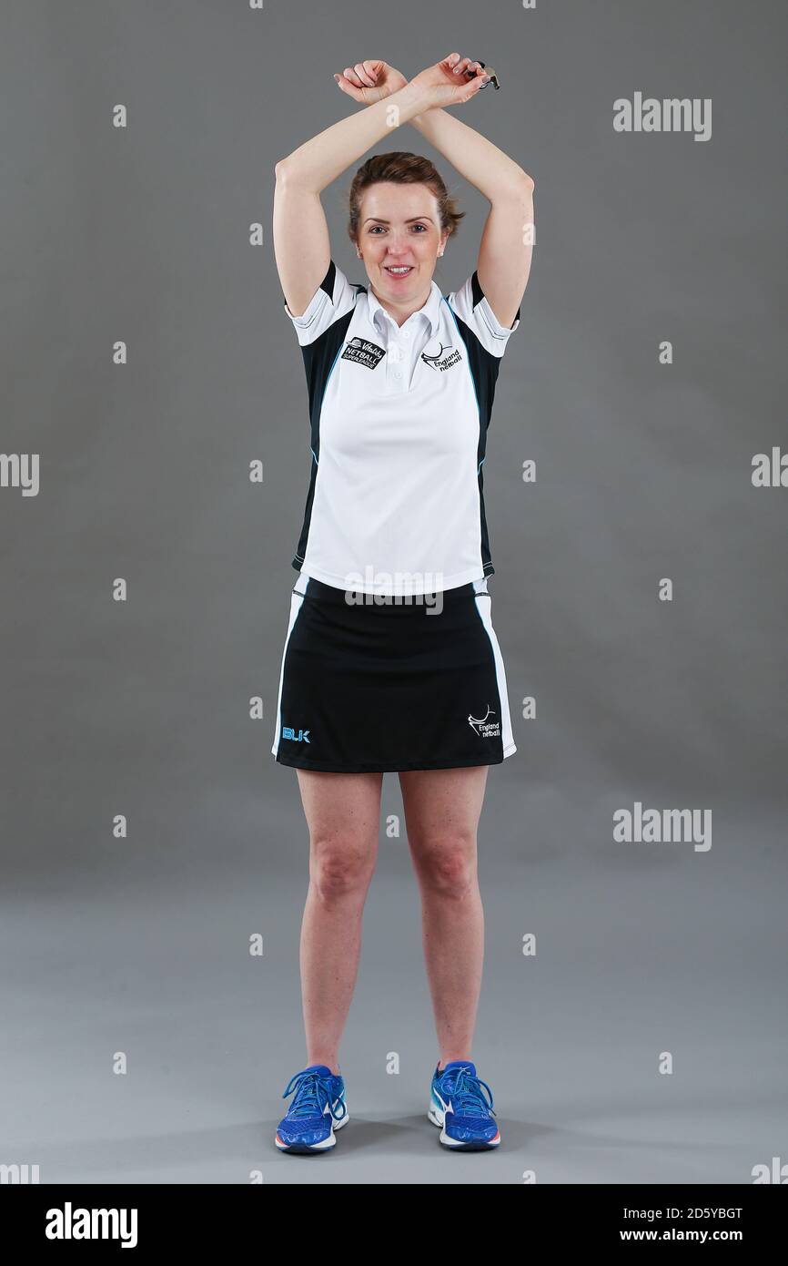 Umpire Louise Travis signalling warning Stock Photo - Alamy
