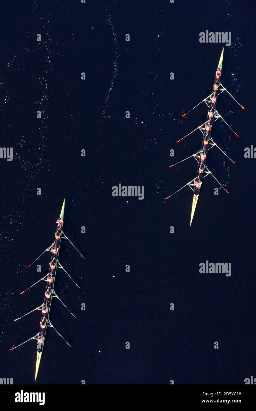 Elevated view of two rowing eights in water Stock Photo - Alamy