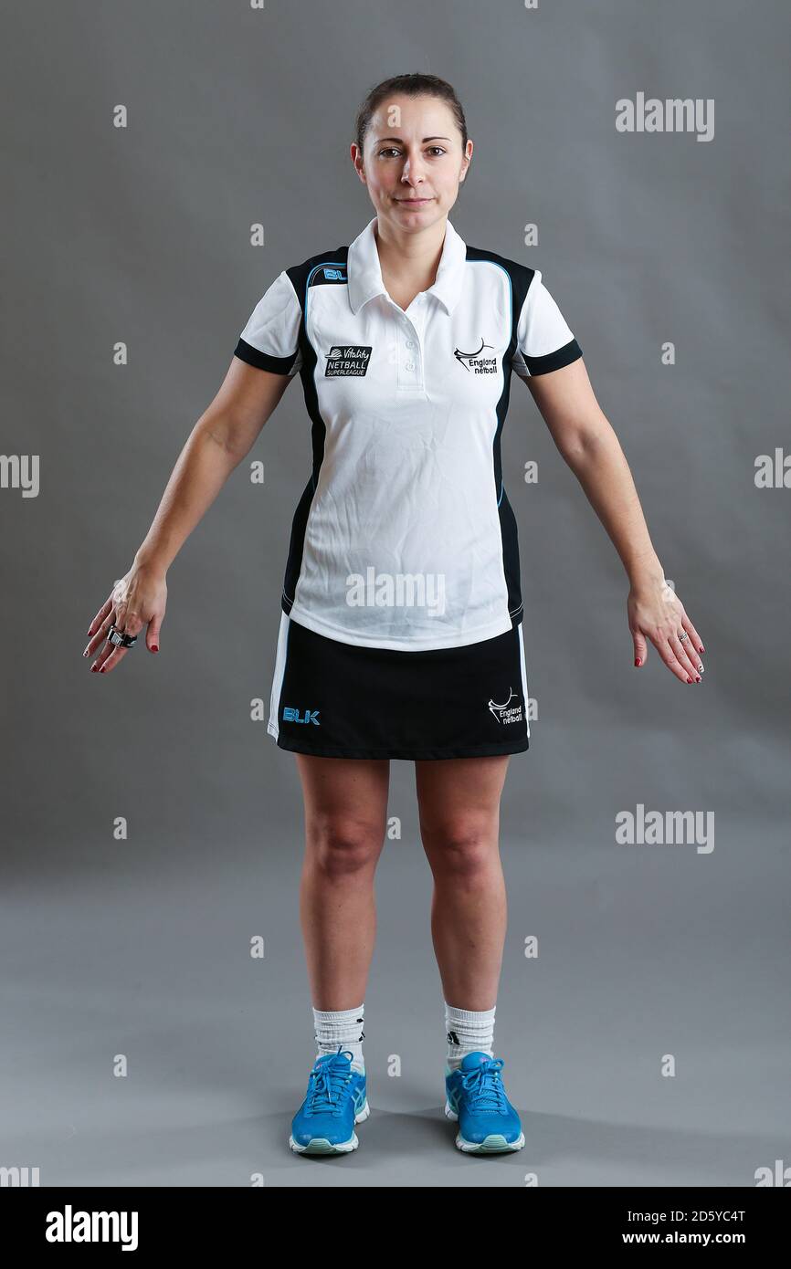 Umpire Kate Mann signalling obstruction of player with ball Stock Photo ...