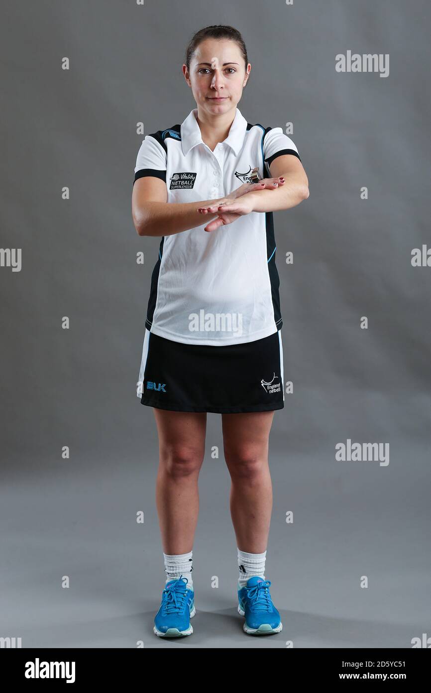 Umpire Kate Mann signalling contact Stock Photo - Alamy
