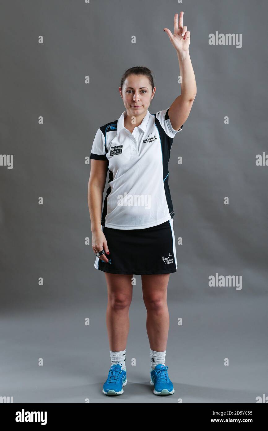Umpire Kate Mann signalling held ball Stock Photo - Alamy