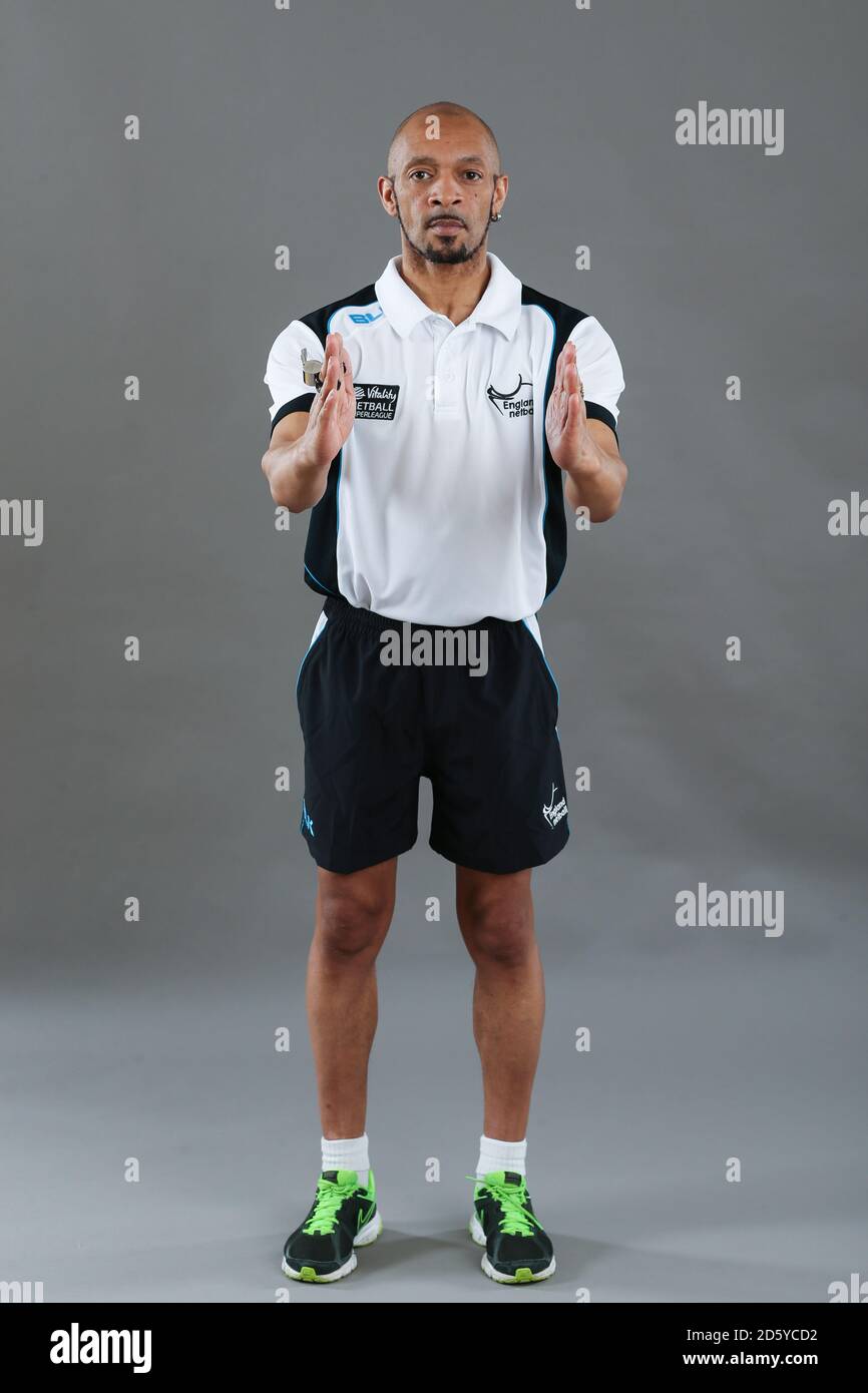 Umpire Ian Fuller signalling obstruction of player with ball Stock ...