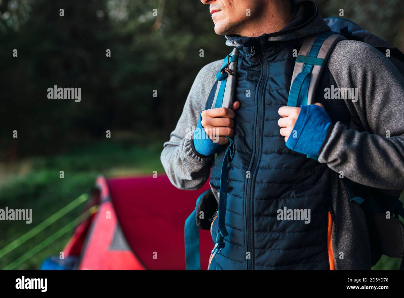 Man camping in Estonia, leaving camp with backpack for a hike Stock ...