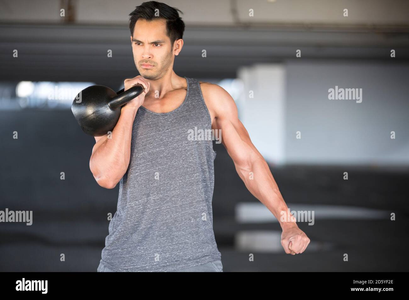 Serious man training arms hi-res stock photography and images - Alamy
