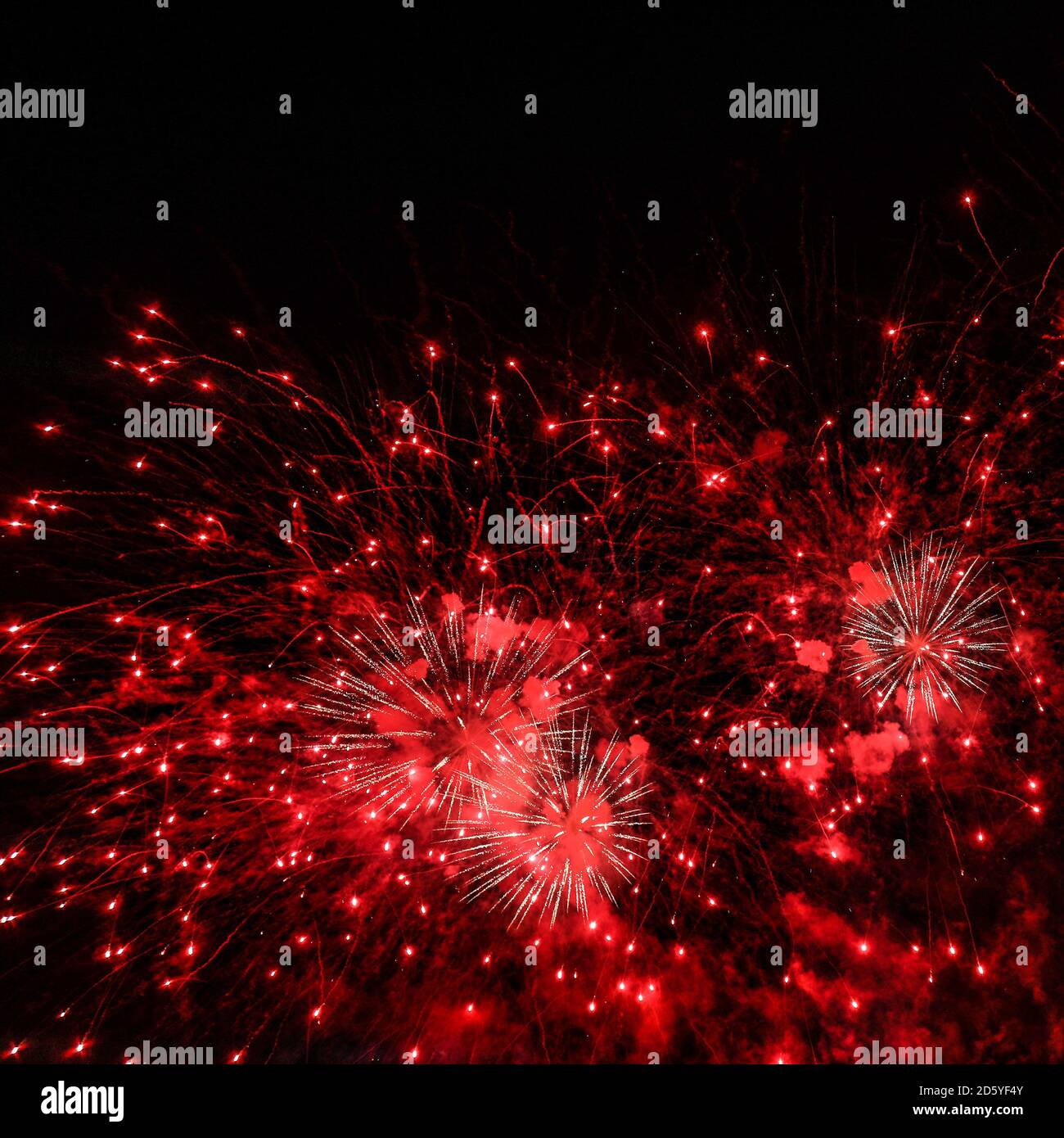 Red fireworks on black sky background Stock Photo - Alamy