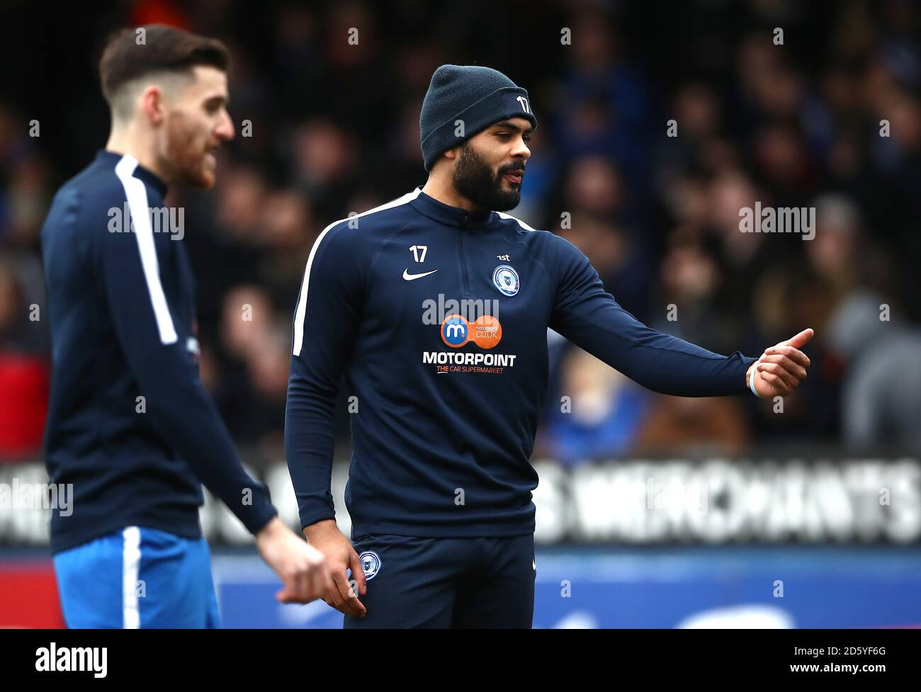 Peterborough United's Alex Penny (centre) warms up prior to the match ...