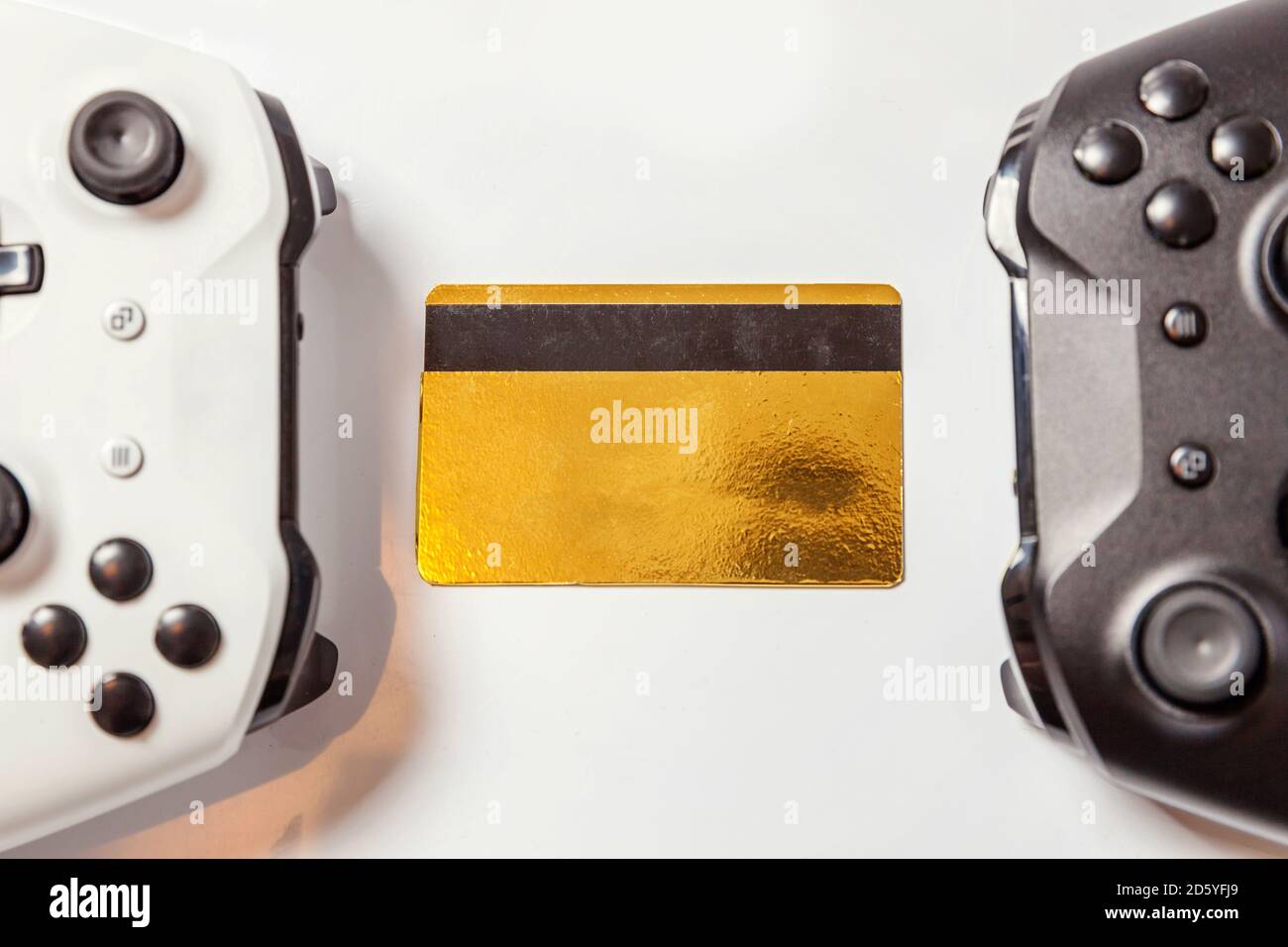 White black two joystick gamepad game console golden credit card ...