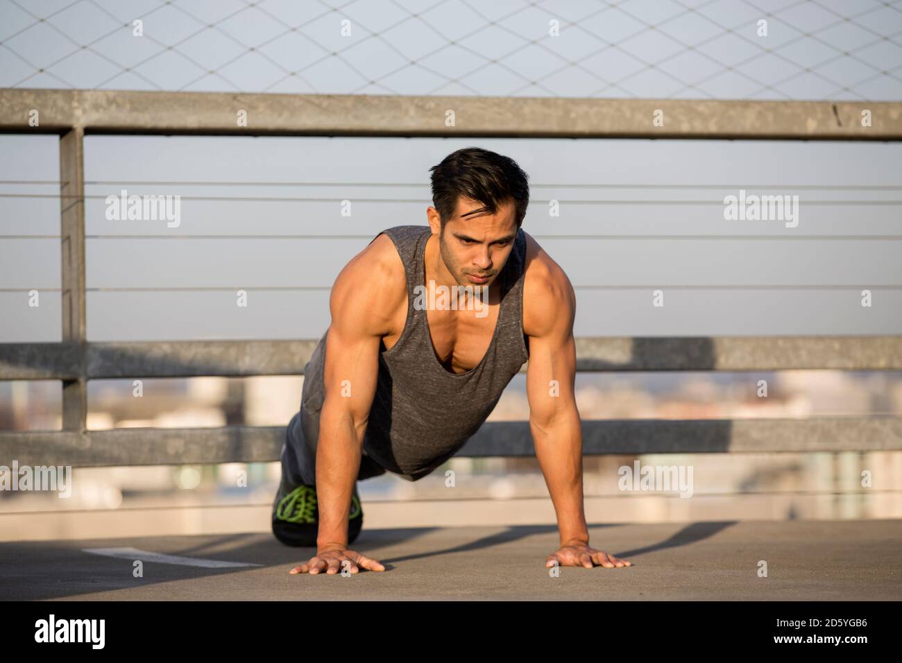 Muscular man doing pushups Stock Photo - Alamy
