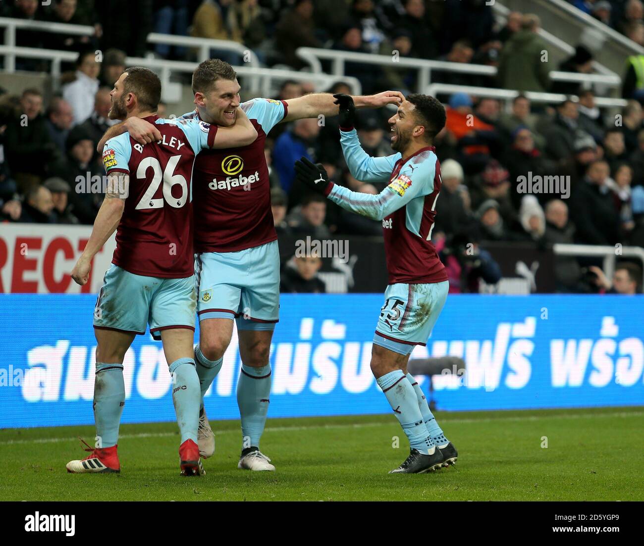 Burnley's Sam Vokes (centre) celebrates with Phil Bardsley (left) and ...