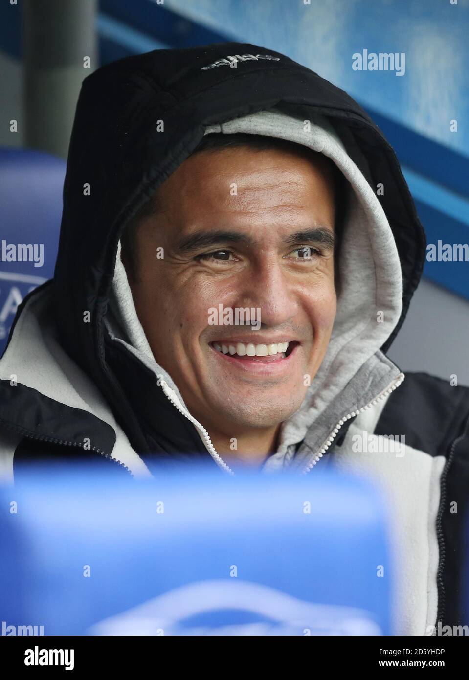 Millwall's Tim Cahill sits in the dugout before kick off Stock Photo ...