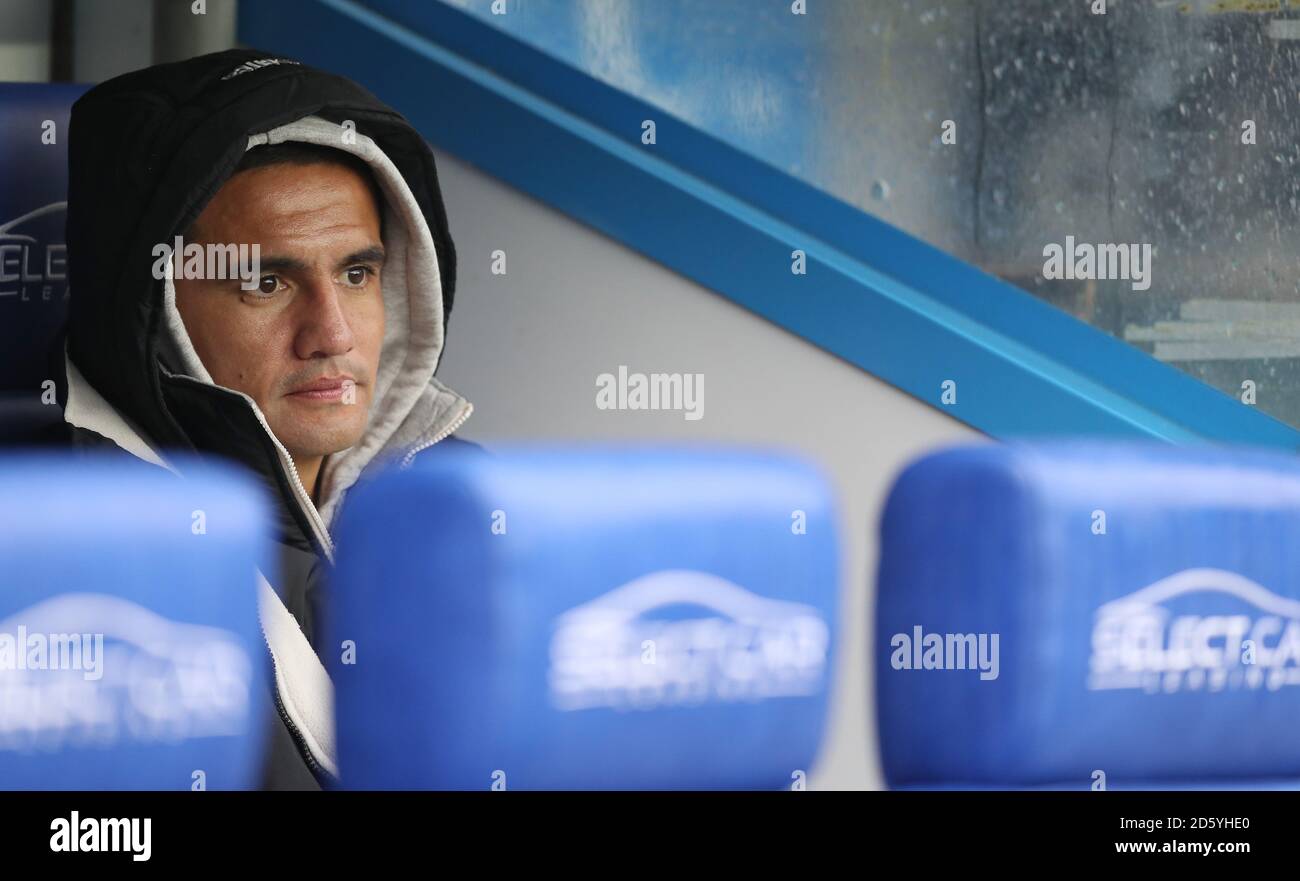 Millwall's Tim Cahill sits in the dugout before kick off Stock Photo ...