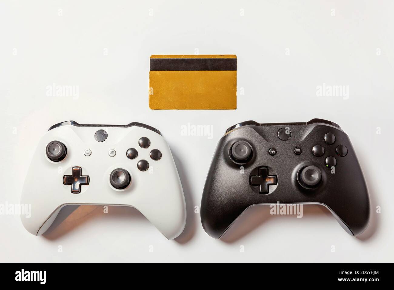 White black two joystick gamepad game console golden credit card ...