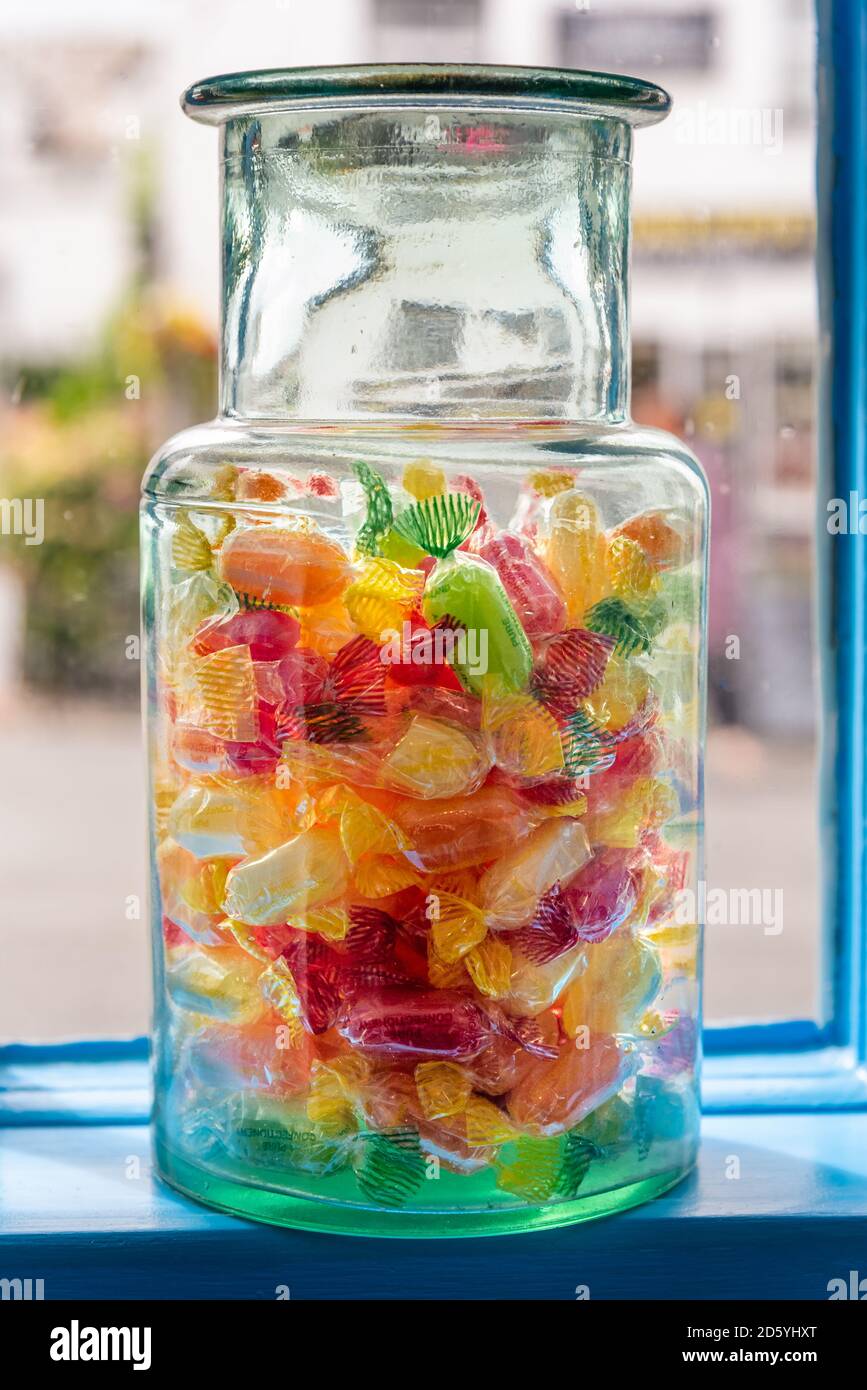 Old fashioned glass sweet jar in the window of a sweet shop Stock Photo ...