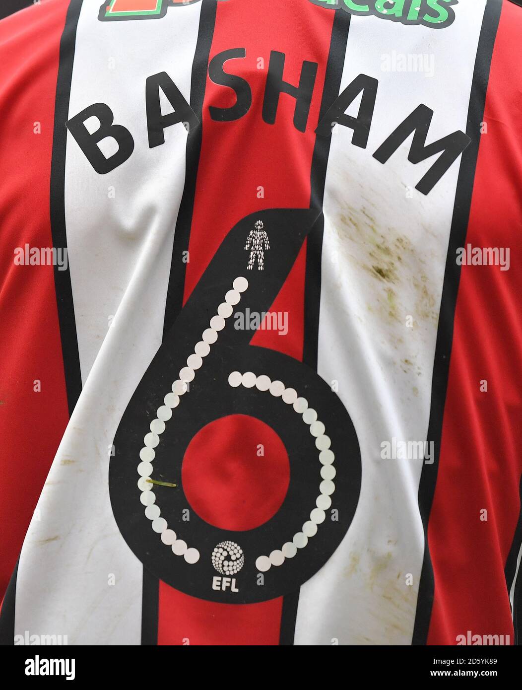 Sheffield United's Chris Basham with the man of men symbol on his shirt ...