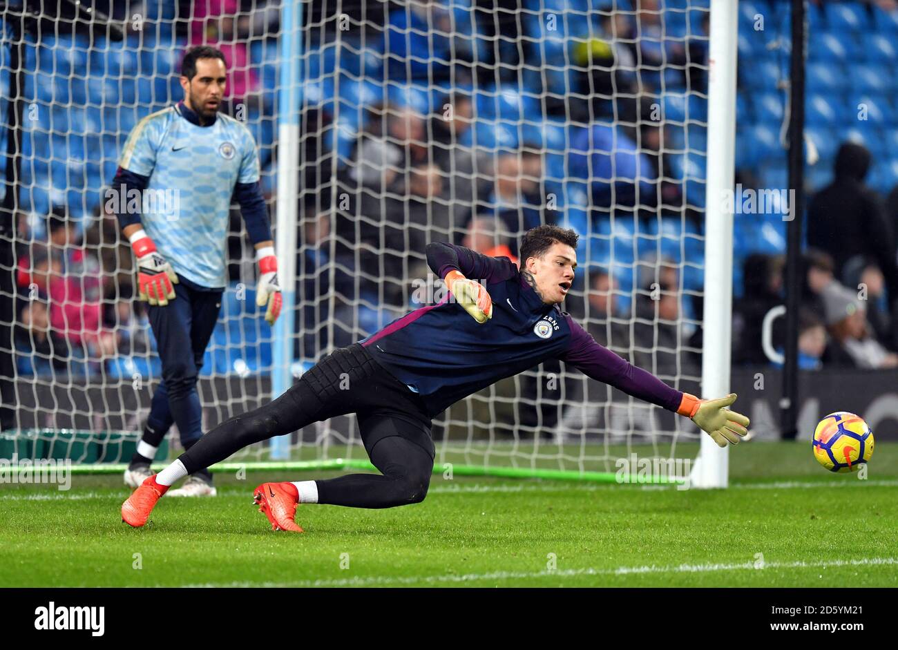 Manchester City goalkeeper Ederson warms up before the game watched by ...
