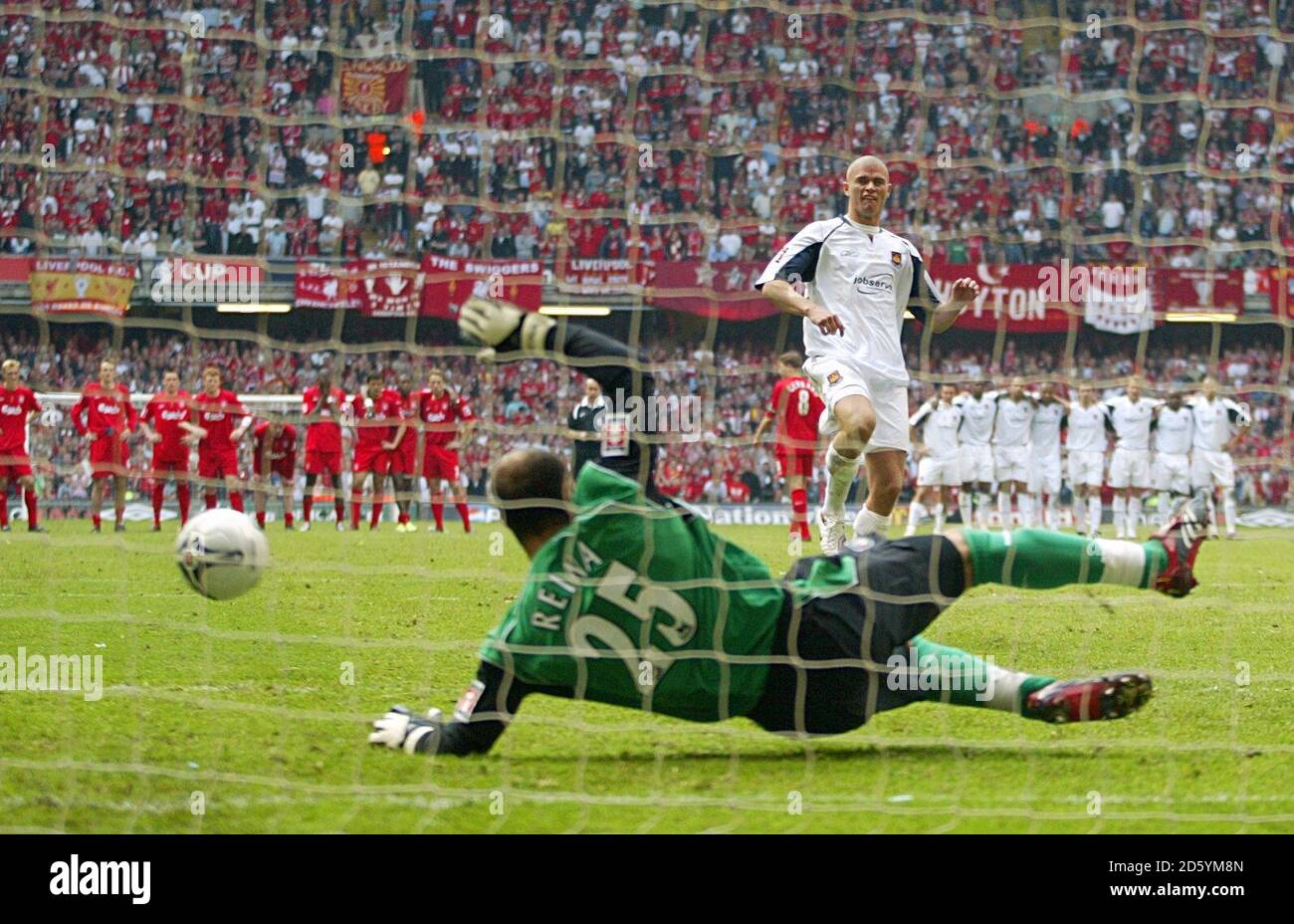 Liverpool goalkeeper Jose Reina saves a penalty from West Ham United's ...