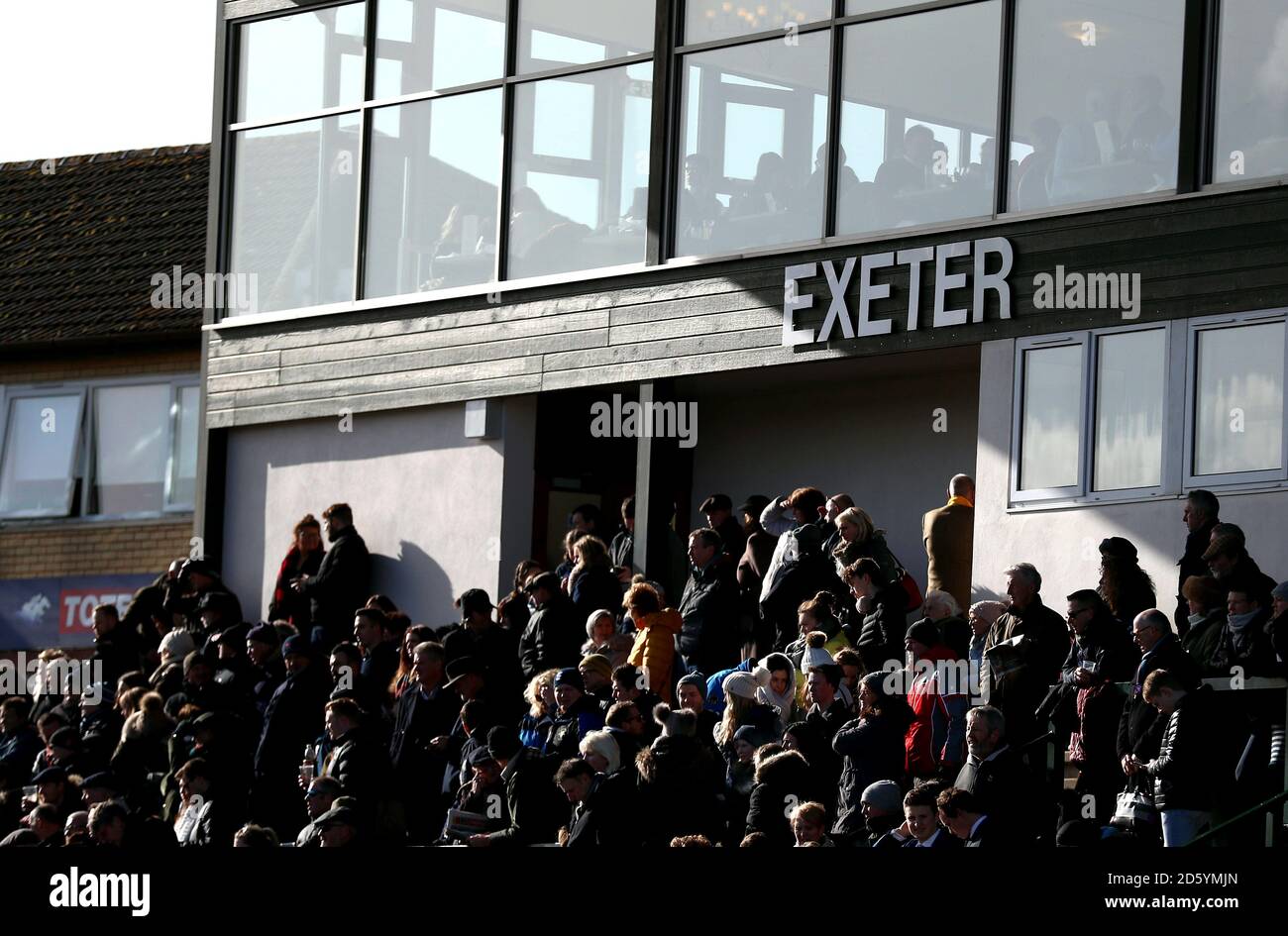 Racegoers in the grandstand during Super Sunday at Exeter Racecourse ...