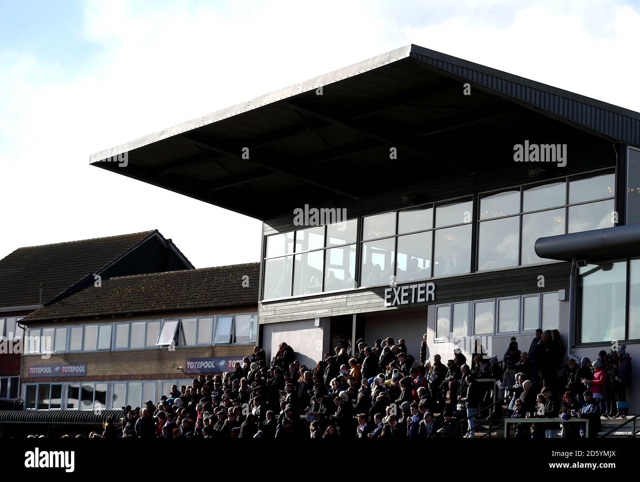 Racegoers in the grandstand during Super Sunday at Exeter Racecourse ...