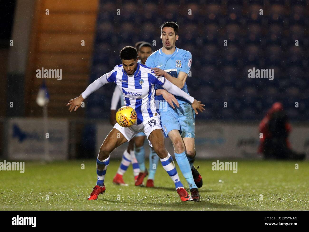 Colchester United's Mikael Mandron (left) and Coventry City's Peter ...