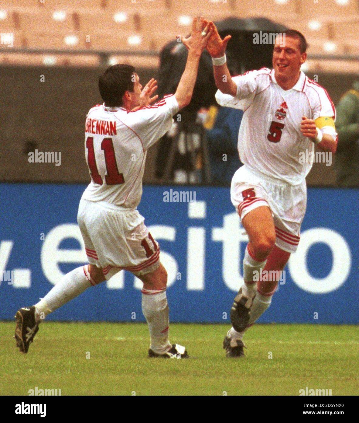 Canada's Jason De Vos (r) is congratulated by teammate Jim Brennan (l ...