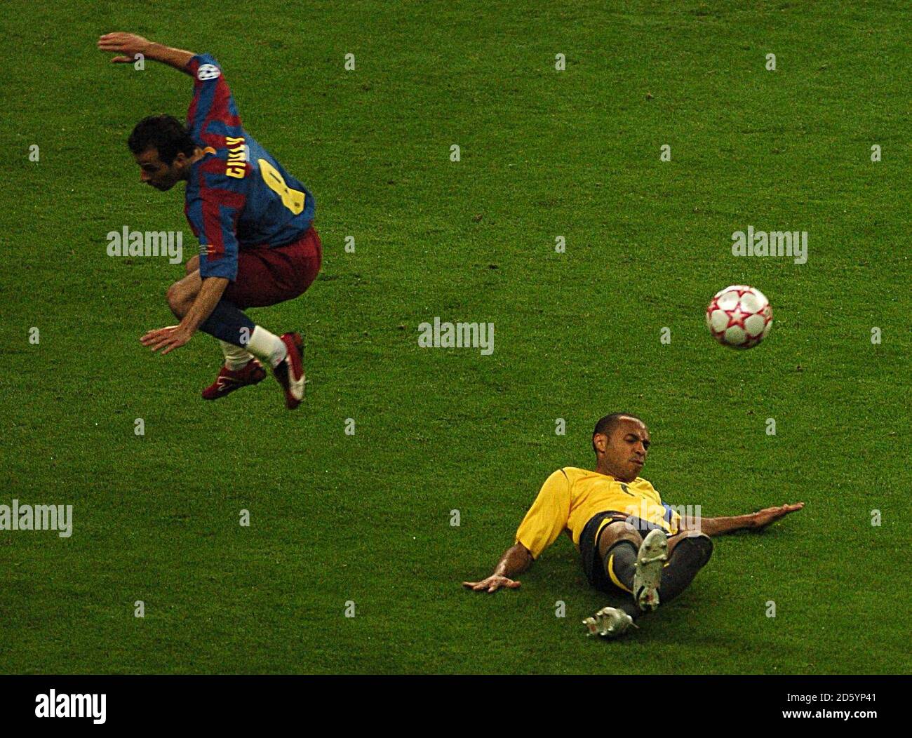 Arsenal's Thierry Henry tackles Barcelona's Ludovic Guily Stock Photo ...