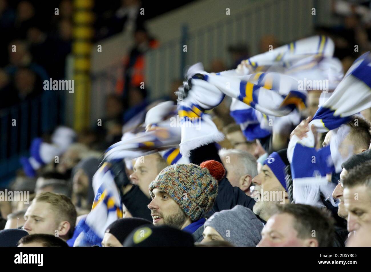 Leeds fans waving scarves Stock Photo - Alamy