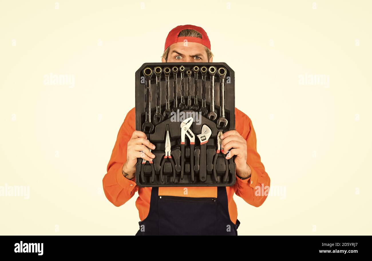 Professional equipment. Man in uniform carries toolbox white background ...