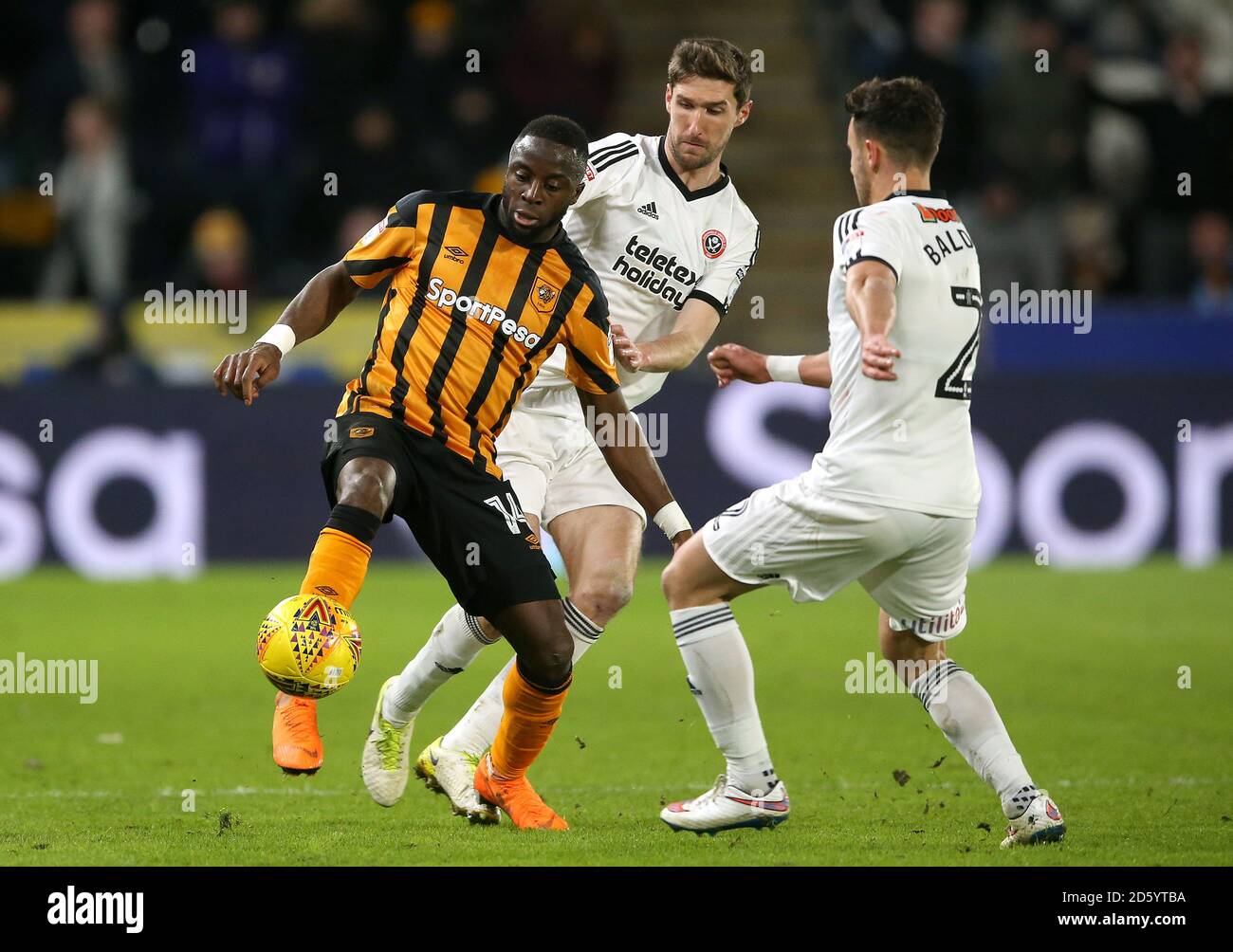 Hull City's Adama Diomande (left) in action with Sheffield United's ...
