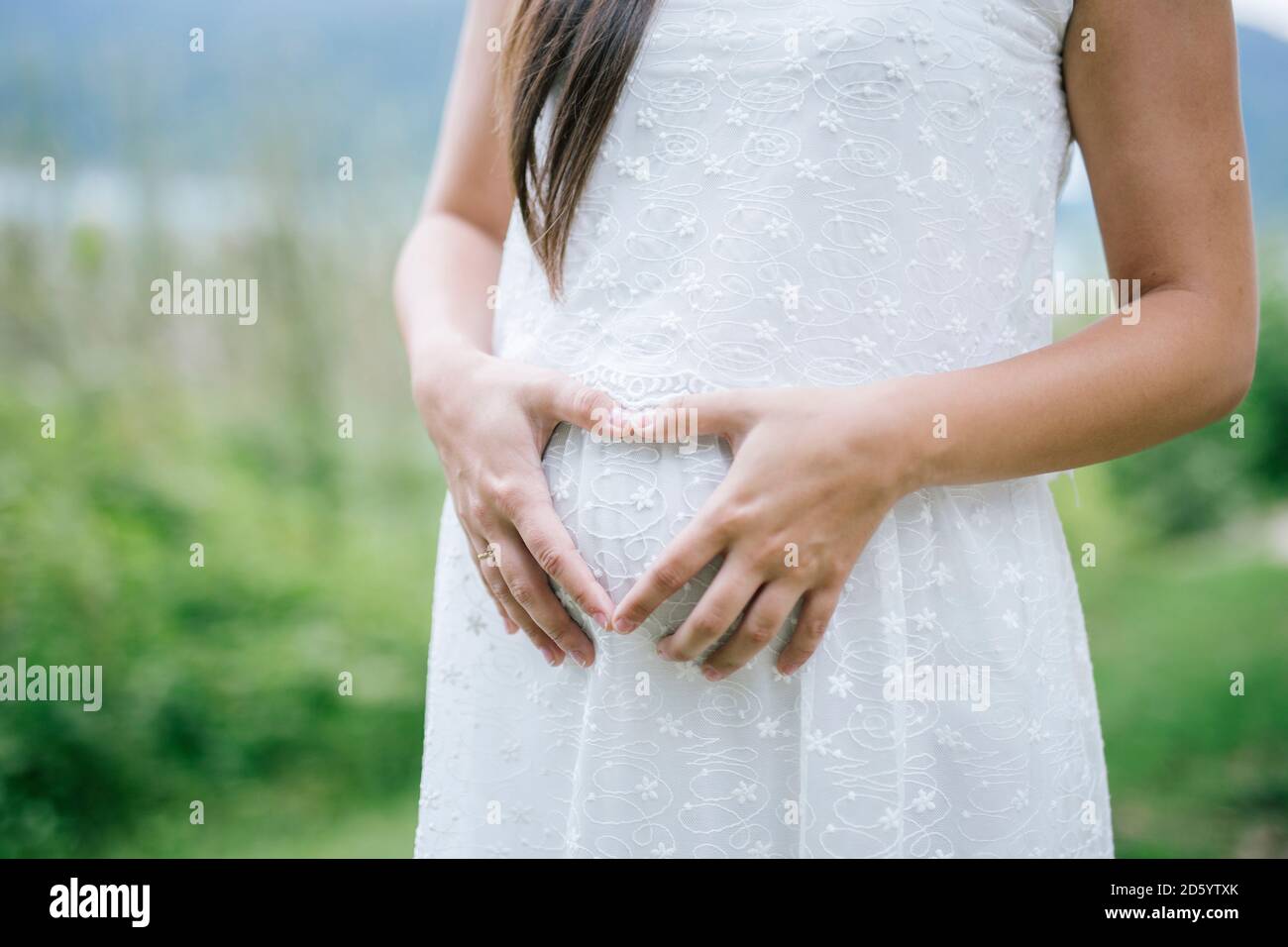 Hand on the belly hi-res stock photography and images - Alamy