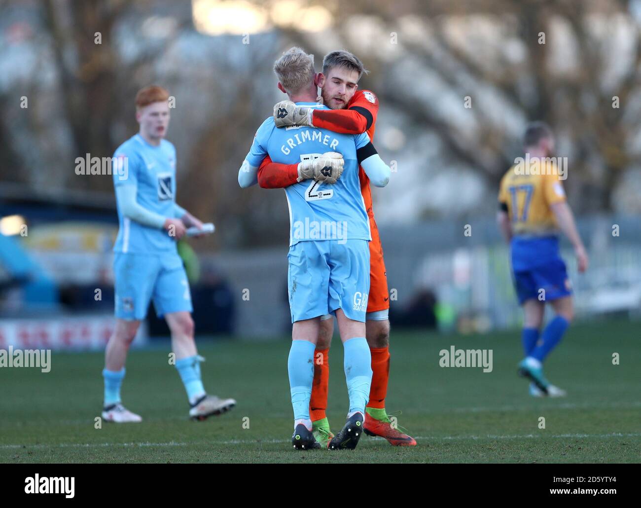 Coventry City goalkeeper Lee Burge greets teammate Jack Grimmer after ...