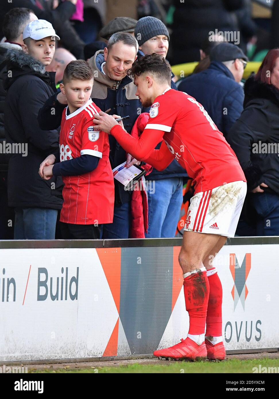 Nottingham Forest's Matty Cash signs an autograph for a fan after the ...