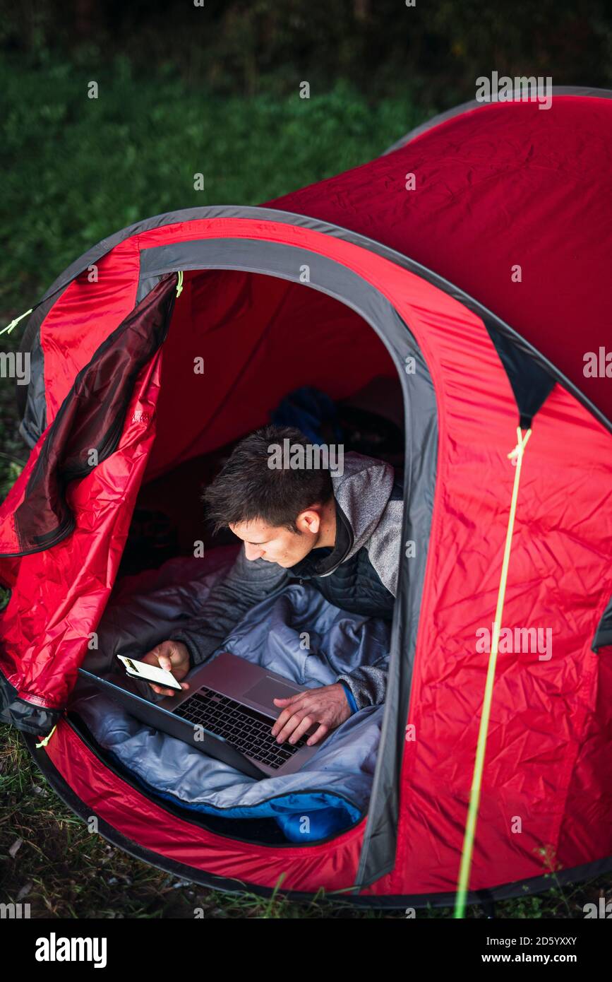 Man Using Laptop Computer Camping High Resolution Stock Photography and ...