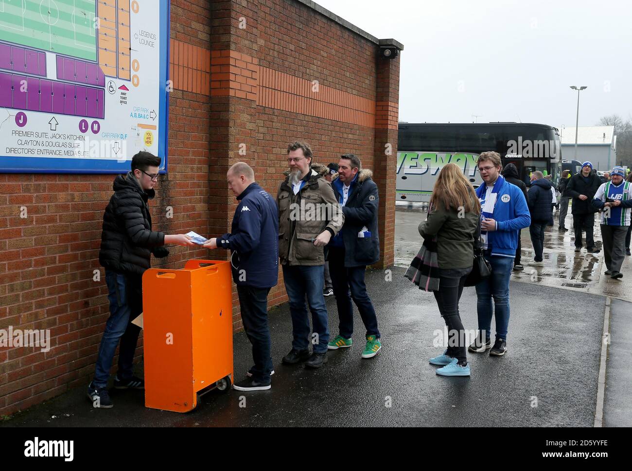 A programme seller stands outside Blackburn Rovers Ewood Park stadium ...