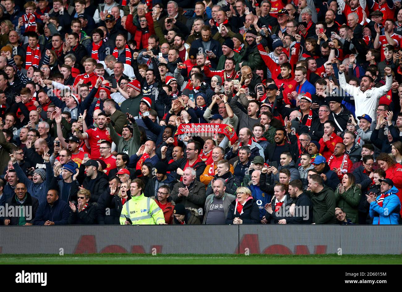 Manchester United fans in the stands celebrate Marcus Rashford scoring ...