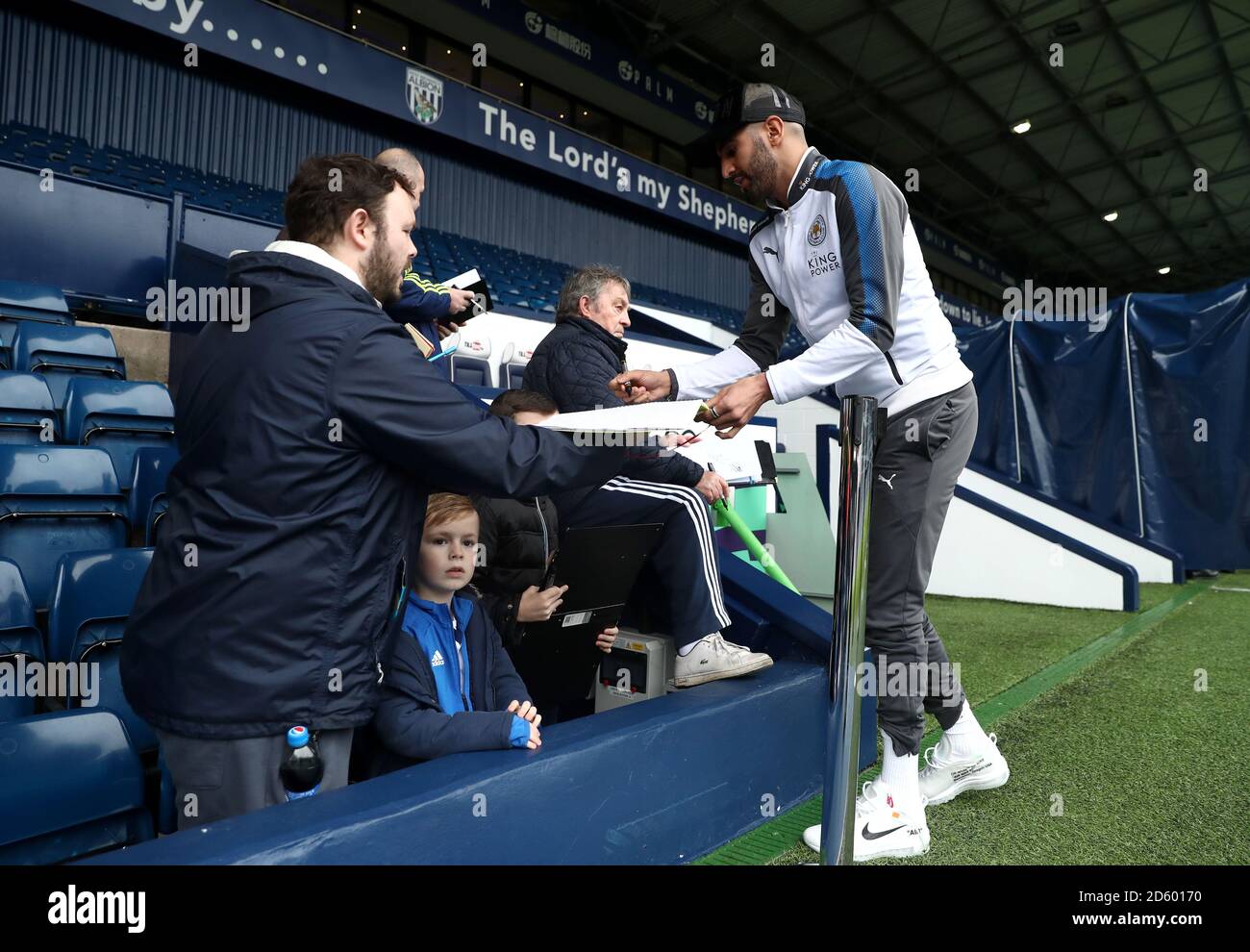 Leicester City's Riyad Mahrez signs autographs for fans before kick-off ...