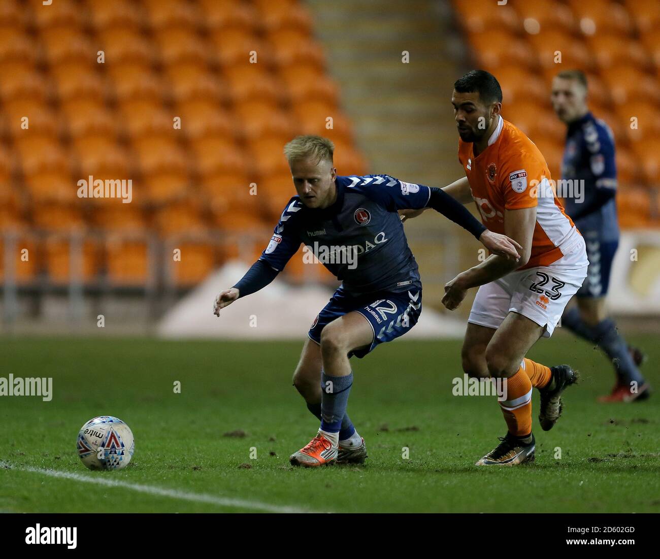 Charlton Athletic's Ben Reeves holds off Blackpool's Kyle Letheren ...