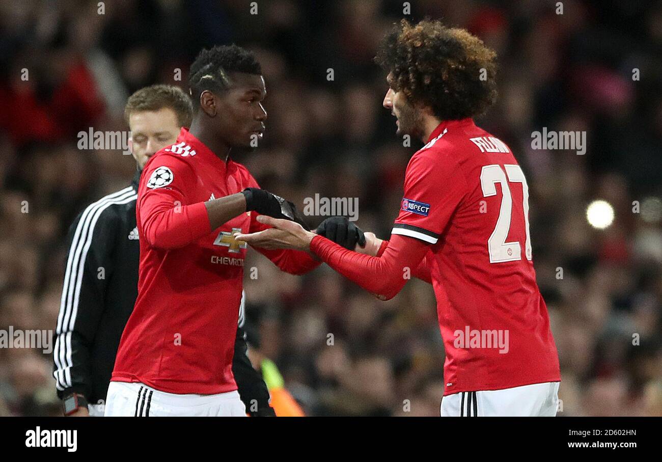 Manchester United's Paul Pogba (left) replaces team-mate Marouane ...
