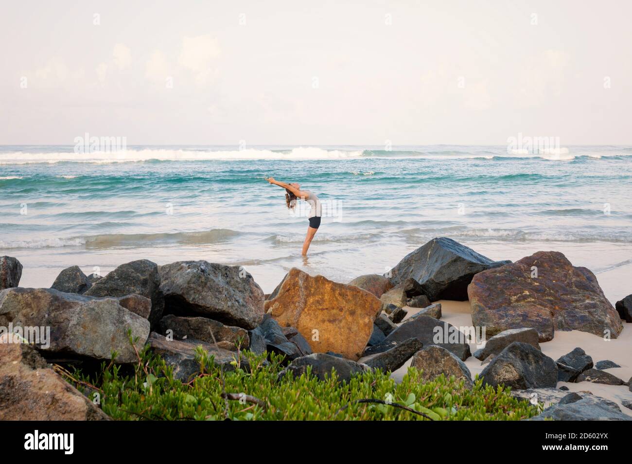 Sri Lanka, Kabalana, young woman practicing yoga at the coast Stock ...
