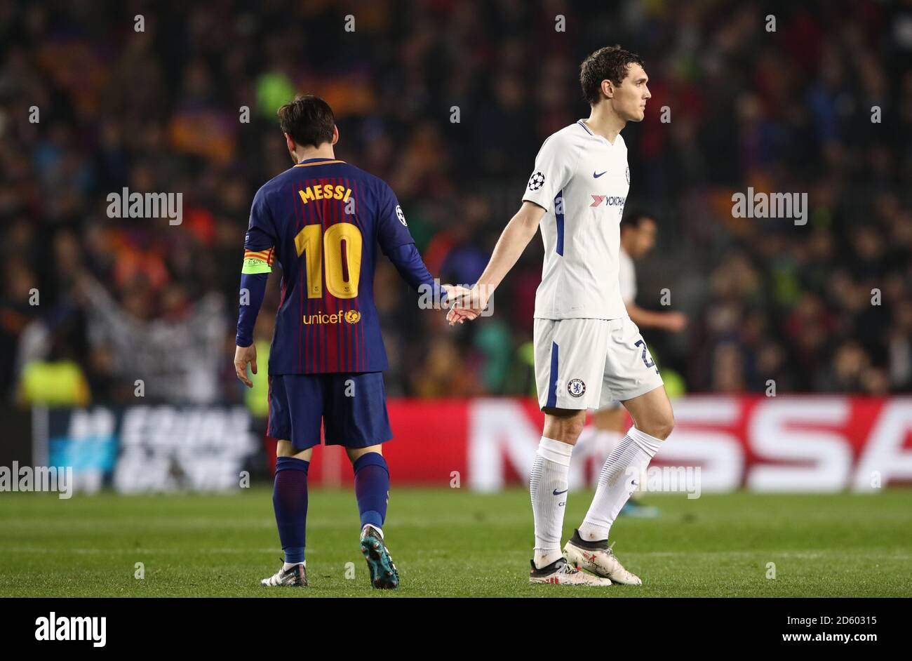 Barcelona's Lionel Messi (left) shakes hands with Chelsea's Andreas ...